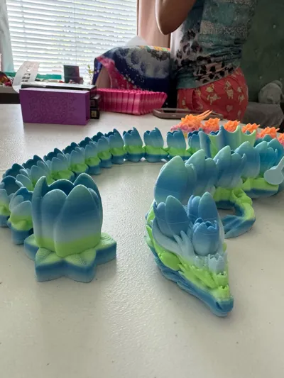 Articulated flexi dragon Tulips - Free 3D Print Model - MakerWorld
