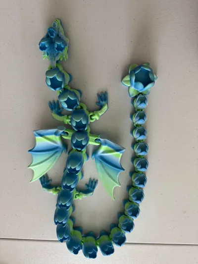 Articulated flexi dragon Tulips - Free 3D Print Model - MakerWorld