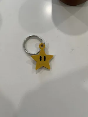 Mario star keychain by nicodeimos - MakerWorld