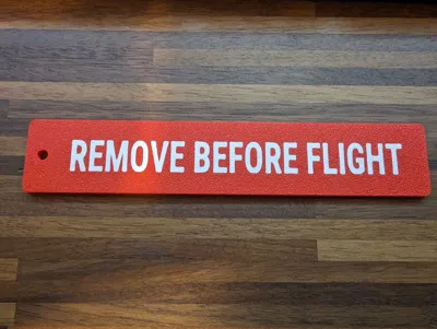 REMOVE BEFORE FLIGHT tag keychain replica by Vega3Dprinting - MakerWorld