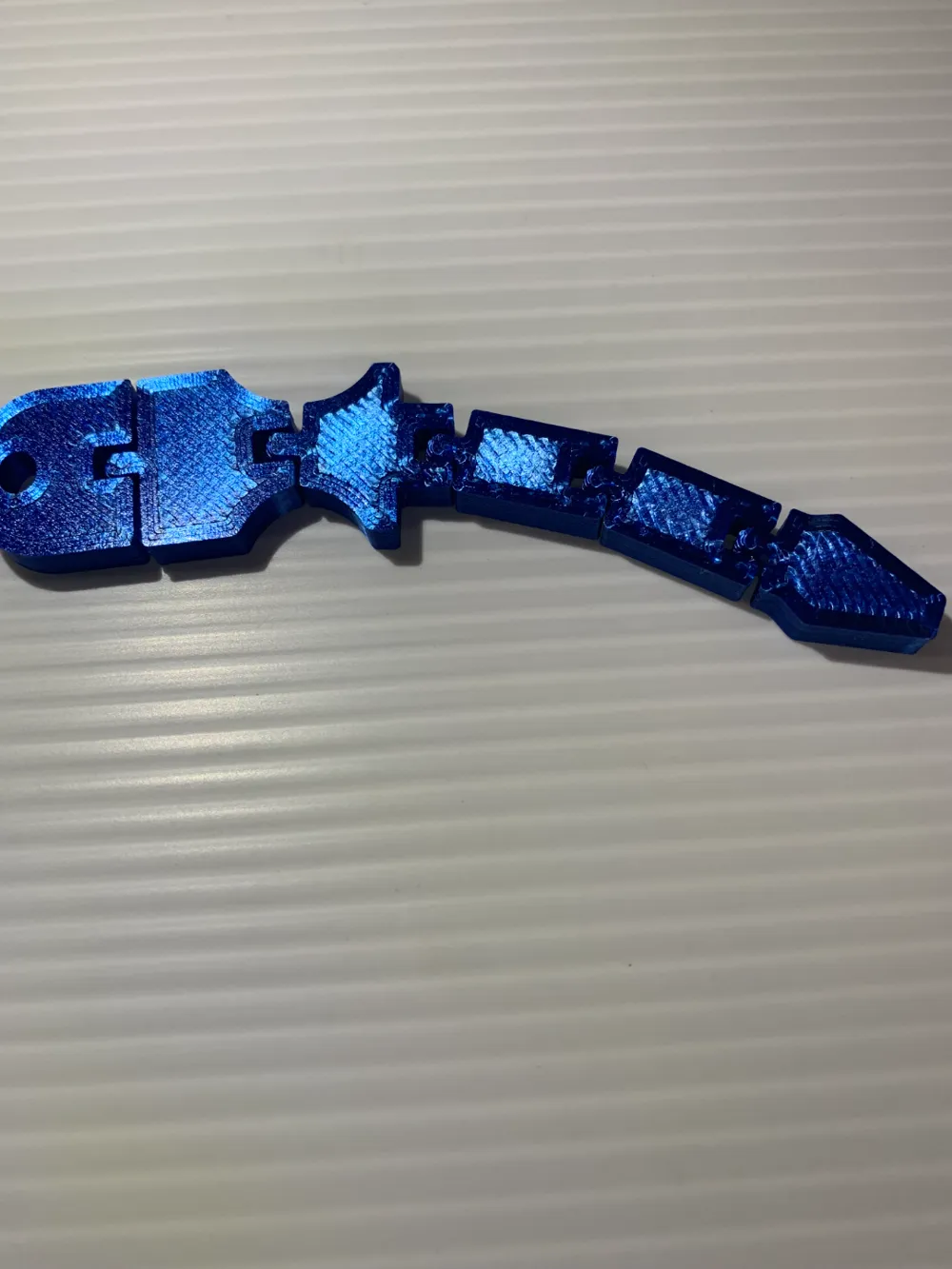 smaller articulating flathead keychain by Frost - MakerWorld