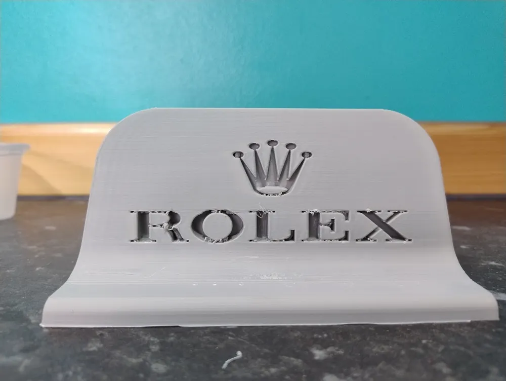 Rolex Logo Laptop stand Remixed by Mr sausageboy - MakerWorld