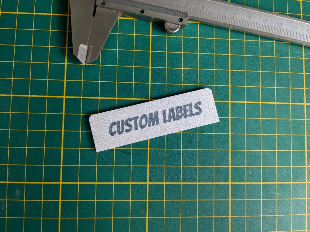 Modern Gridfinity Case Label Maker (Parametric) by Louis MakerWorld: Download Free 3D Models