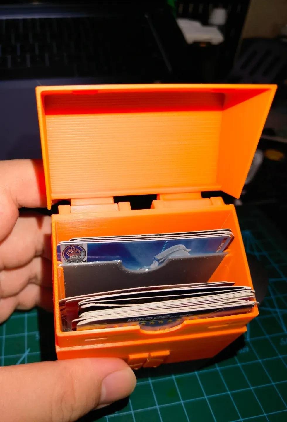 A portable card case for holding playing cards, game cards, IDs, or ...