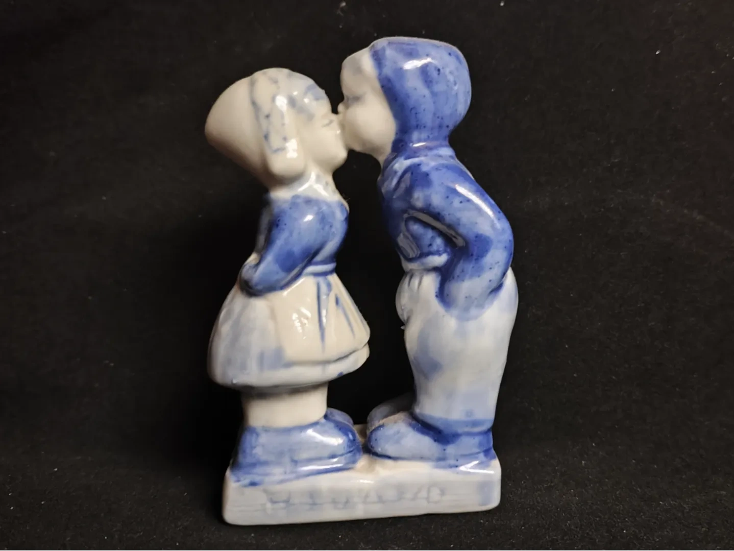 A ceramic kissing figurine, a love token from a bygone era, a tribute ...