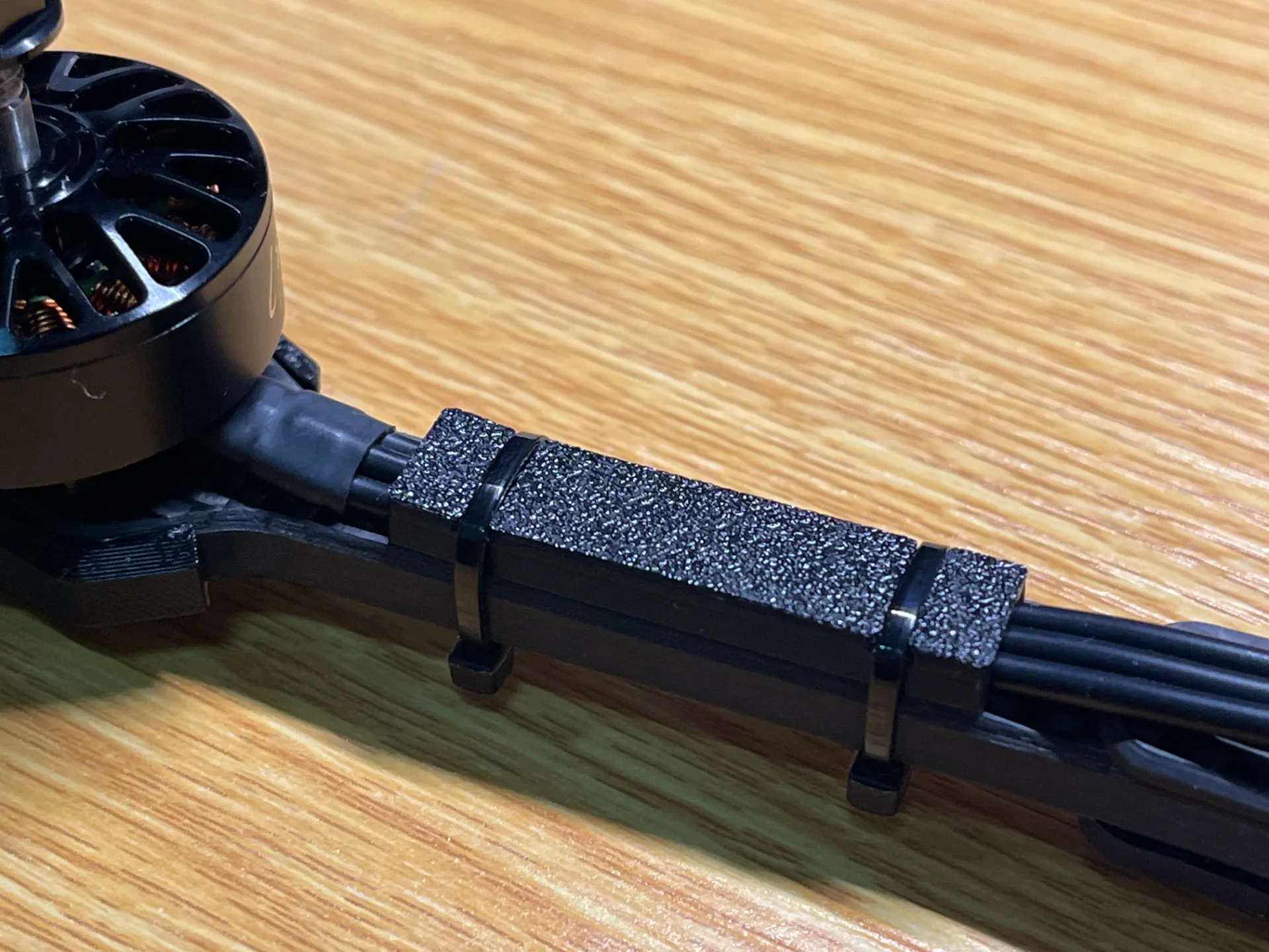 FPV drone motor wire protector, secured with 2mm zip ties, installable ...