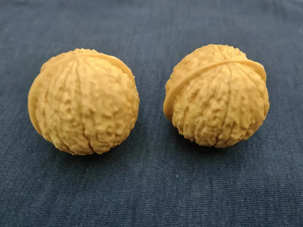 A pair of golden walnuts, ready for playing! by majiweida - MakerWorld