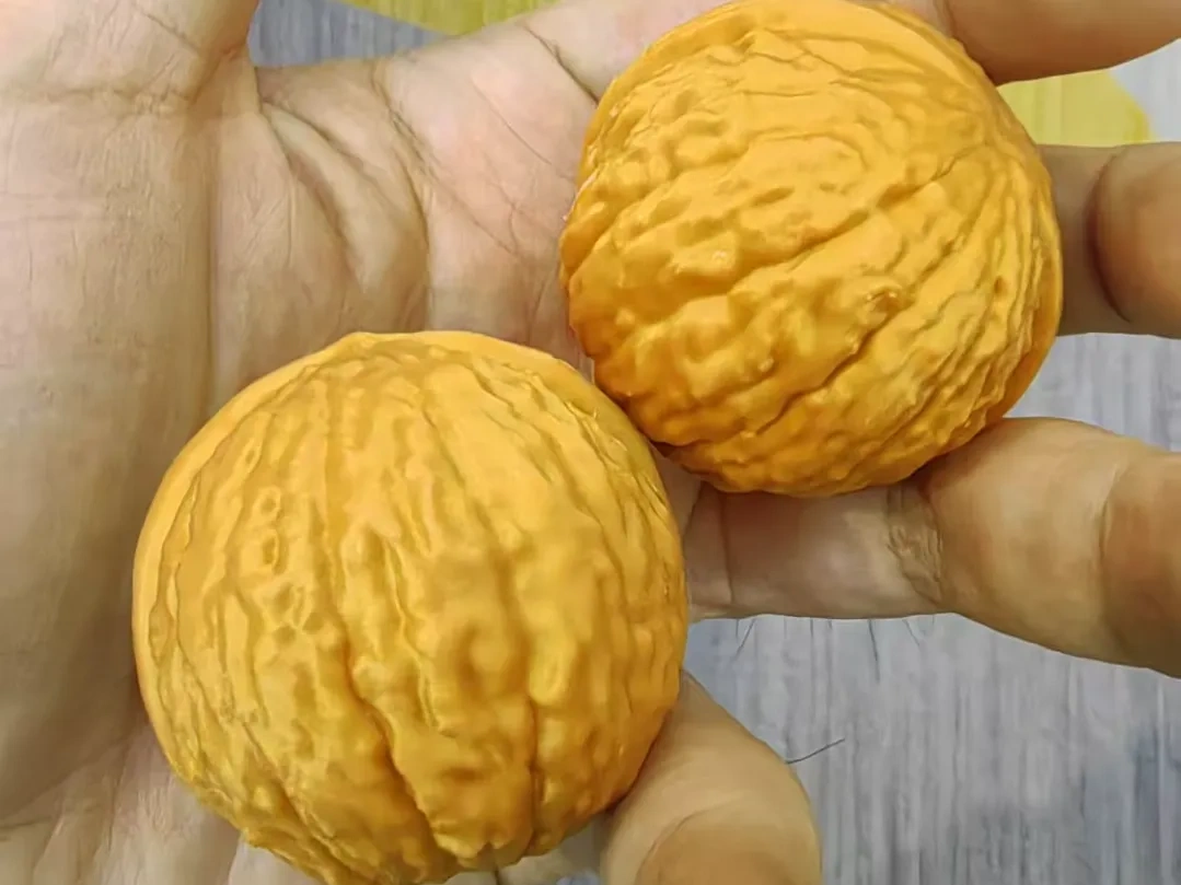 A pair of golden walnuts, ready for playing! by majiweida - MakerWorld