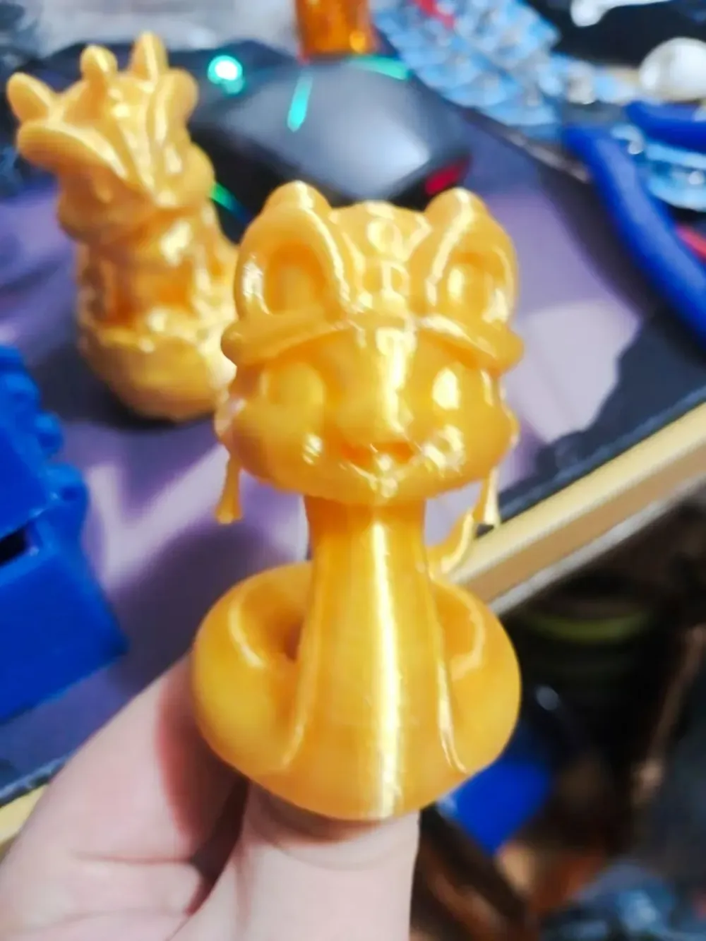 A tiny snake wearing a lion dance headdress by user_2052704866 - MakerWorld