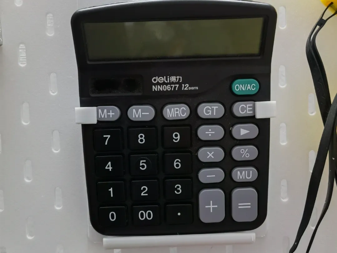 3mm Pegboard Calculator Holder by sapyMakerWorld: Download Free 3D Models