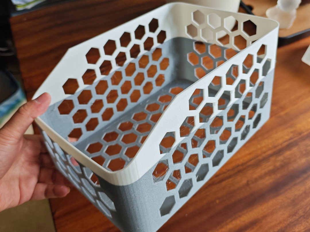 A large, hollow storage box or basket, designed for material efficiency ...