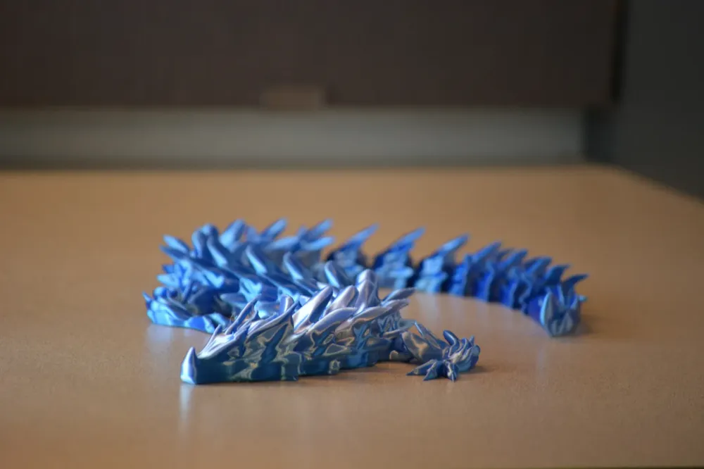 Articulated Full-Motion Dragon Figurine - Free 3D Print Model - MakerWorld