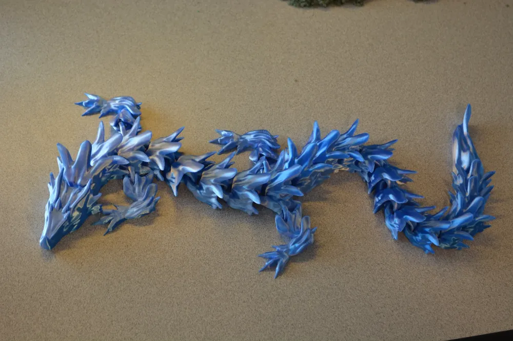 Articulated Full-Motion Dragon Figurine - Free 3D Print Model - MakerWorld