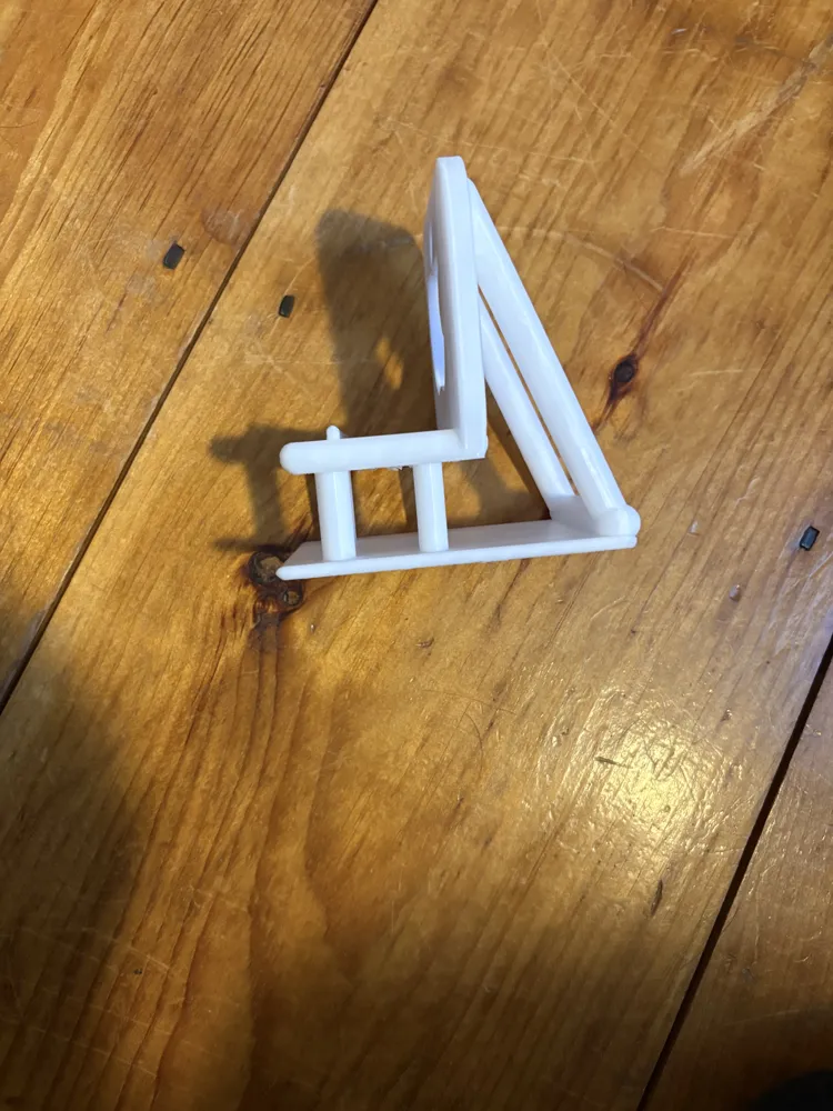 iPhone holder with charging hole - Free 3D Print Model - MakerWorld