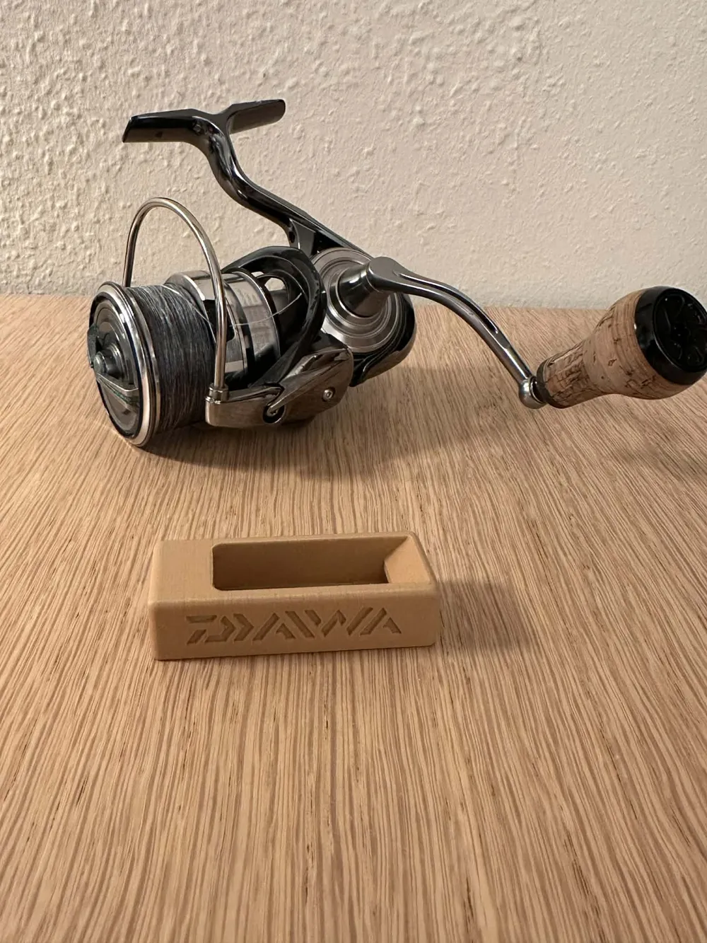 Daiwa fishing reel holder - wall mount - Free 3D Print Model - MakerWorld