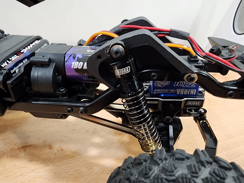 TRX4M Front Shock Mount Relocate - Free 3D Print Model - MakerWorld