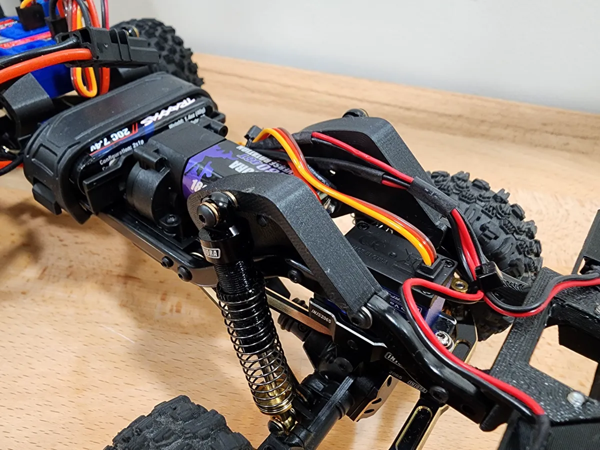 TRX4M Front Shock Mount Relocate - Free 3D Print Model - MakerWorld