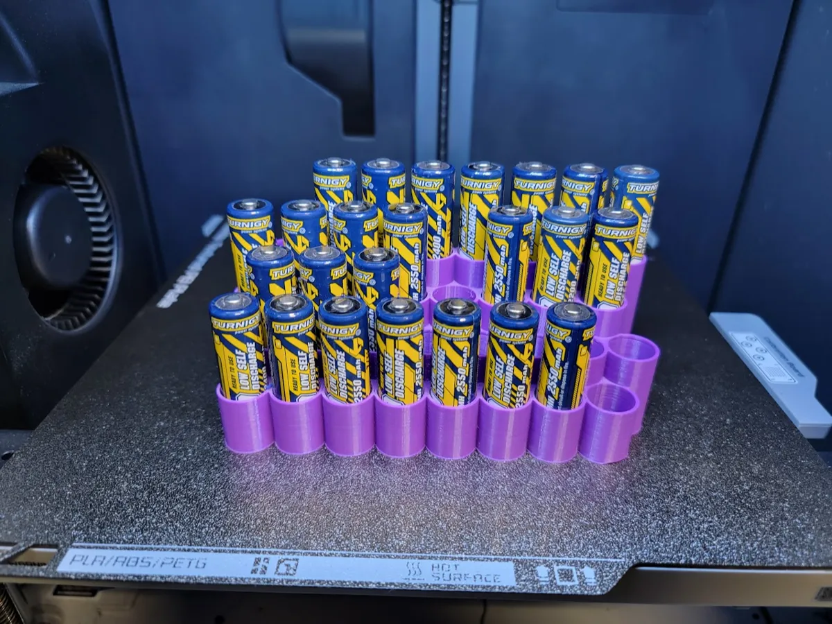 Staggered, raised AA battery holder - Free 3D Print Model - MakerWorld