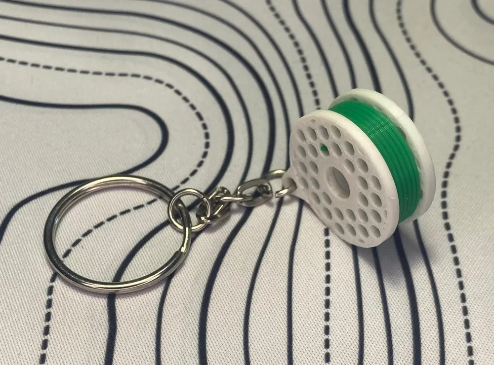 Filament spool key ring by Lamy MakerWorld: Download Free 3D Models