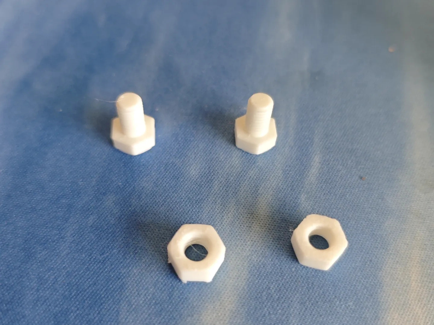 Hexagonal storage box assembly uses 10 screws and 10 nuts for fixation ...