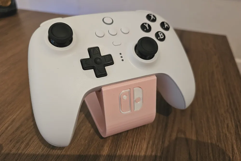 Nintendo Switch controller stand with logo Remixed by Joosdt - MakerWorld