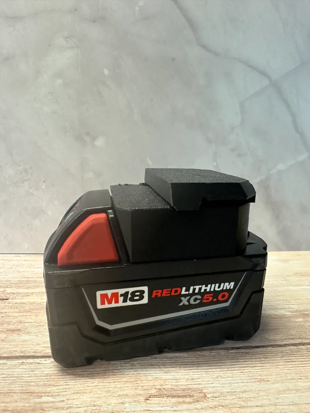 Milwaukee M18 battery pack out holder by jakereardon - MakerWorld