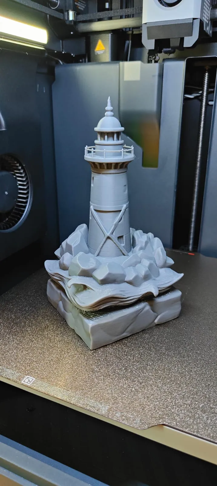 Small diorama of a lighthouse on rocks at sea by Frenk MakerWorld: Download Free 3D Models
