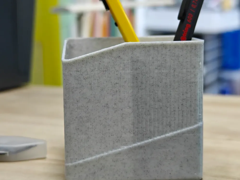 A minimalist modern pen holder with freely adjustable dividers by Dog's ...