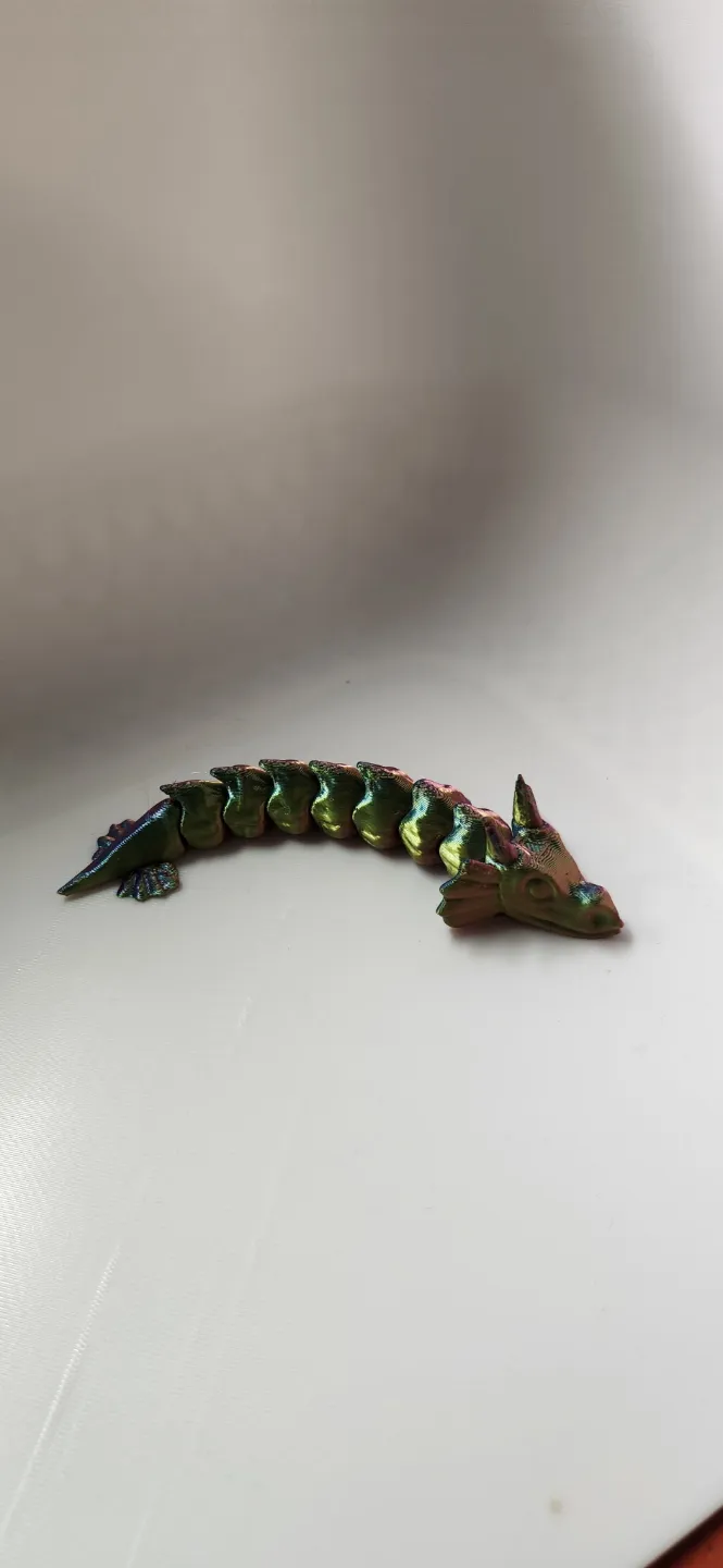 Mini Articulated Dragon - Free 3D Print Model - MakerWorld