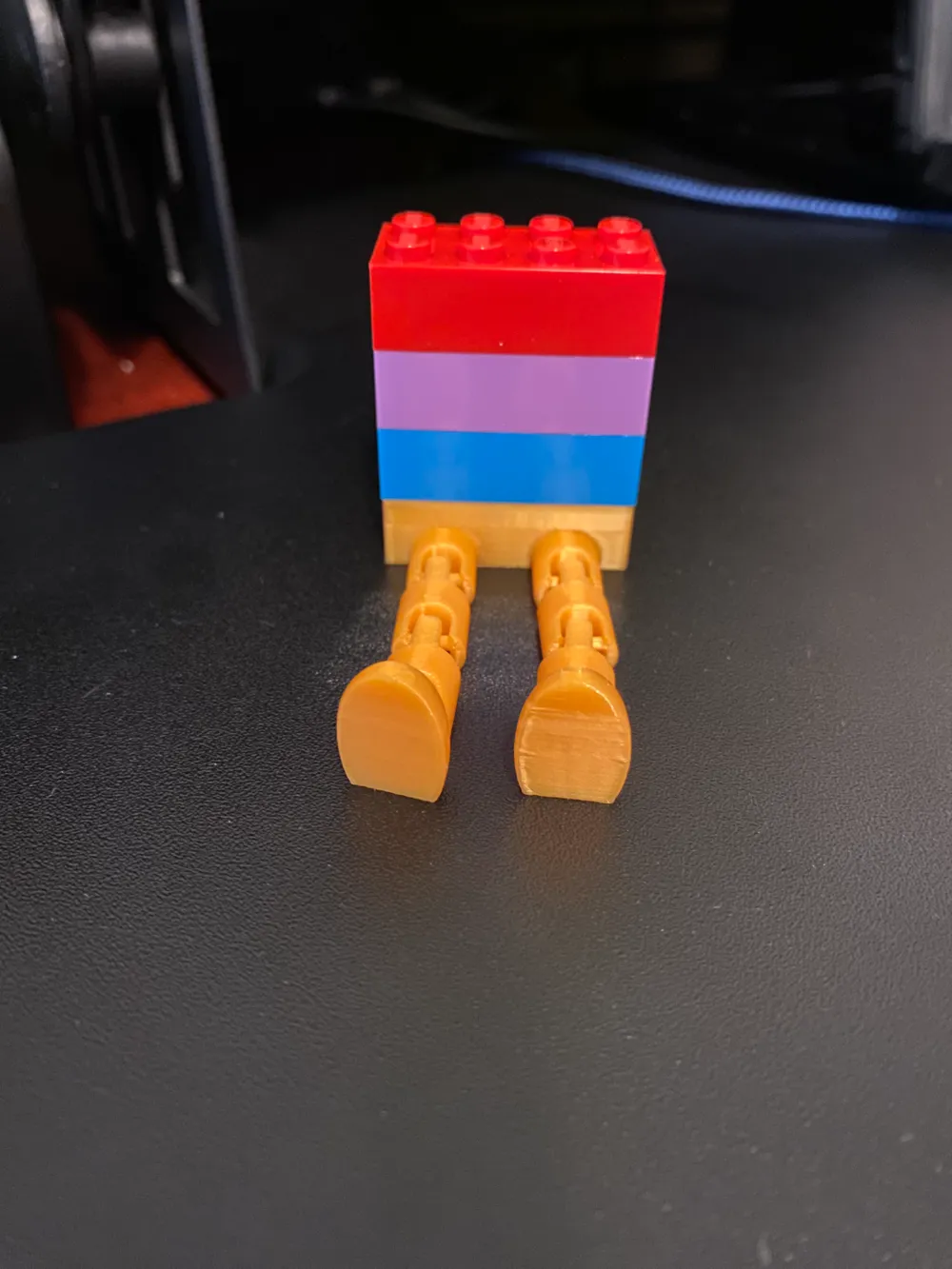 Articulated Stackable Brick Buddy (2x4) by Welch’s 3D Prints - MakerWorld