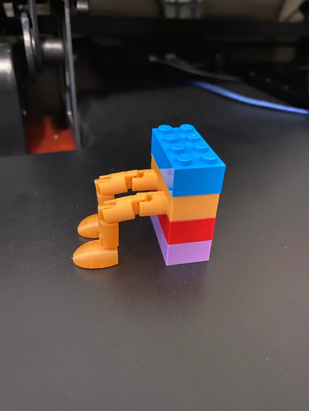 Articulated Stackable Brick Buddy (2x4) by Welch’s 3D Prints - MakerWorld