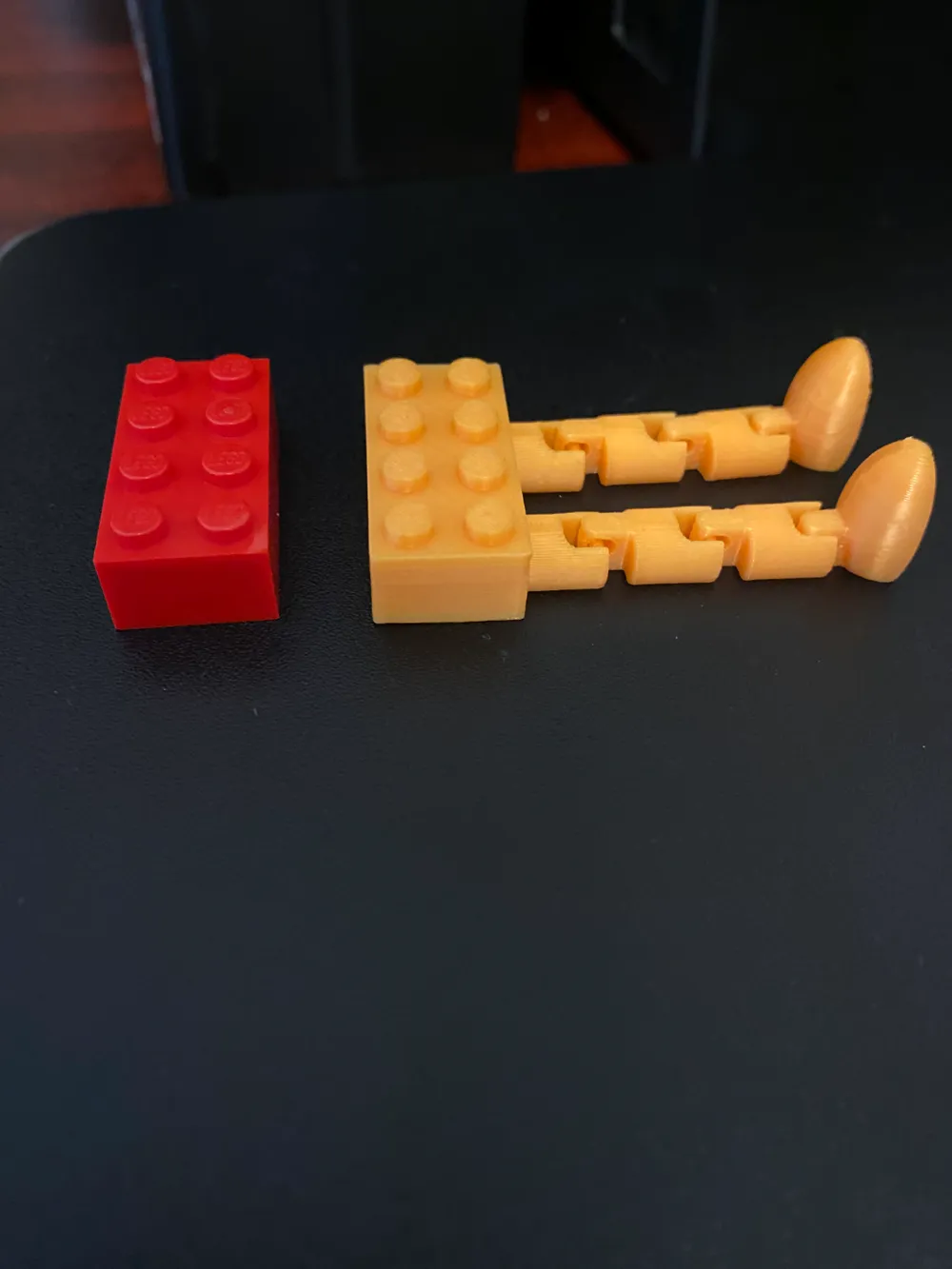 Articulated Stackable Brick Buddy (2x4) by Welch’s 3D Prints - MakerWorld