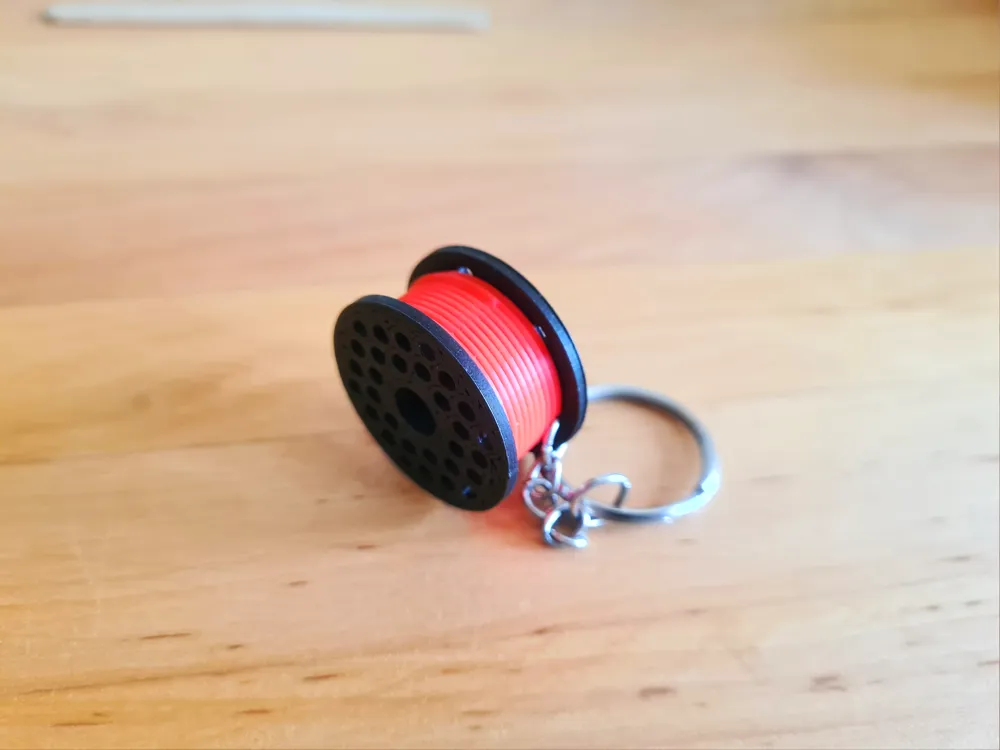 Filament spool keychain (with hanger/wall mount) by Molodos MakerWorld ...