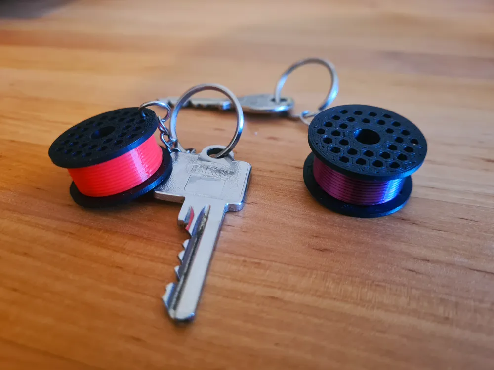 Filament spool keychain (with hanger/wall mount) by Molodos - MakerWorld