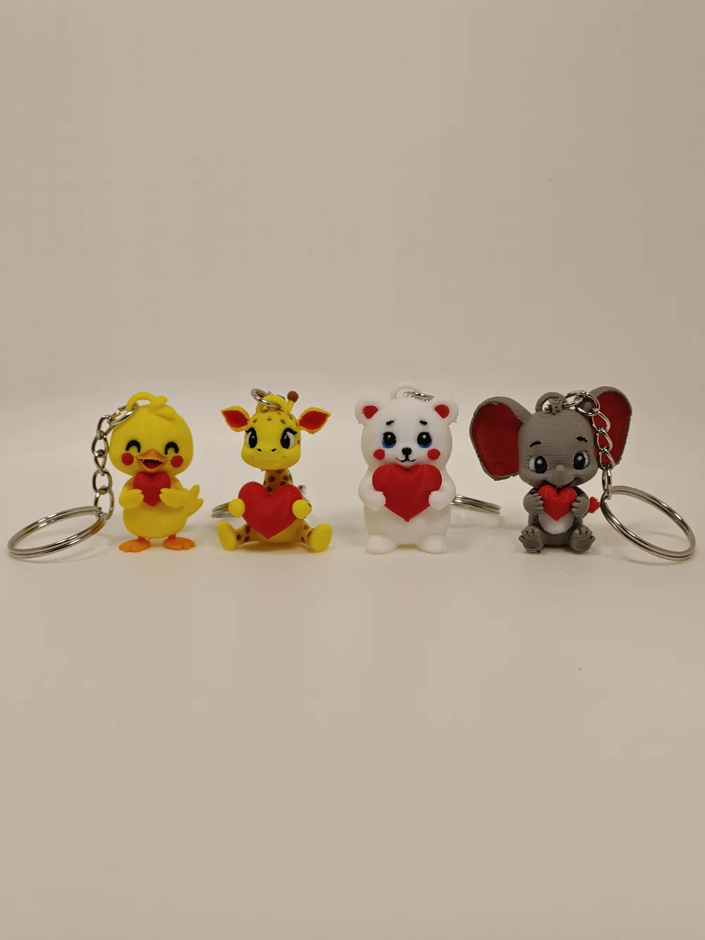 Cute animals holding hearts keychains Vol. 2 - Free 3D Print Model - MakerWorld