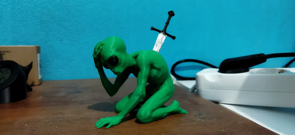Dying Alien in Pain by Sword - Free 3D Print Model - MakerWorld
