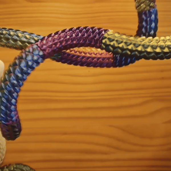 JIG JIG ROPE rolling tangle, a stress-relieving toy, reminiscent of a ...