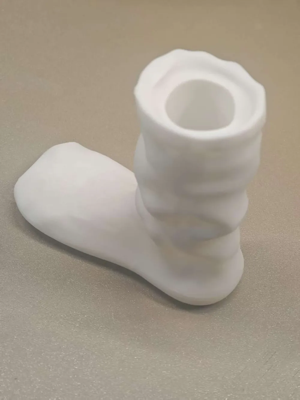 A single sock, which can be used as a pen holder or a phone stand ...