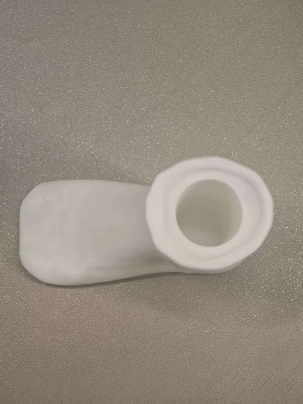 A single sock, which can be used as a pen holder or a phone stand ...