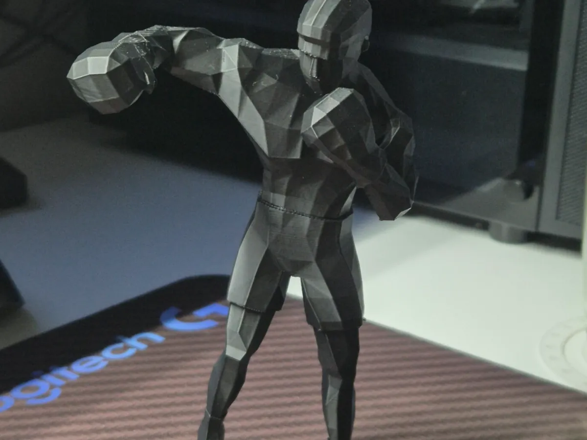 Low-Poly Boxer Pose – Fighter’s Spirit - Free 3D Print Model - MakerWorld