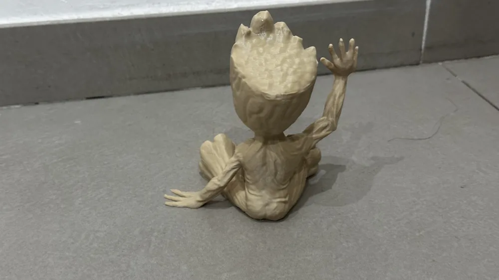 Statue of Baby Groot Hand Raised - Free 3D Print Model - MakerWorld