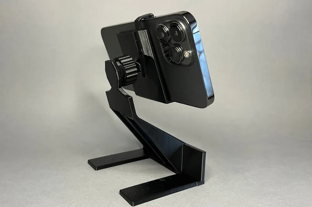 Phone stand on ball joint (adjustable) - Free 3D Print Model - MakerWorld