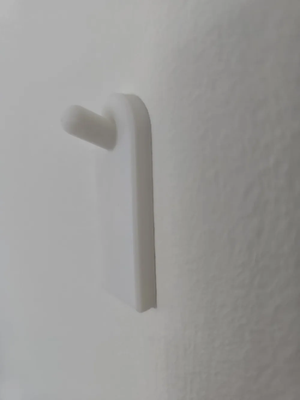 Flush wall hook using adhesive by Kazmima - MakerWorld