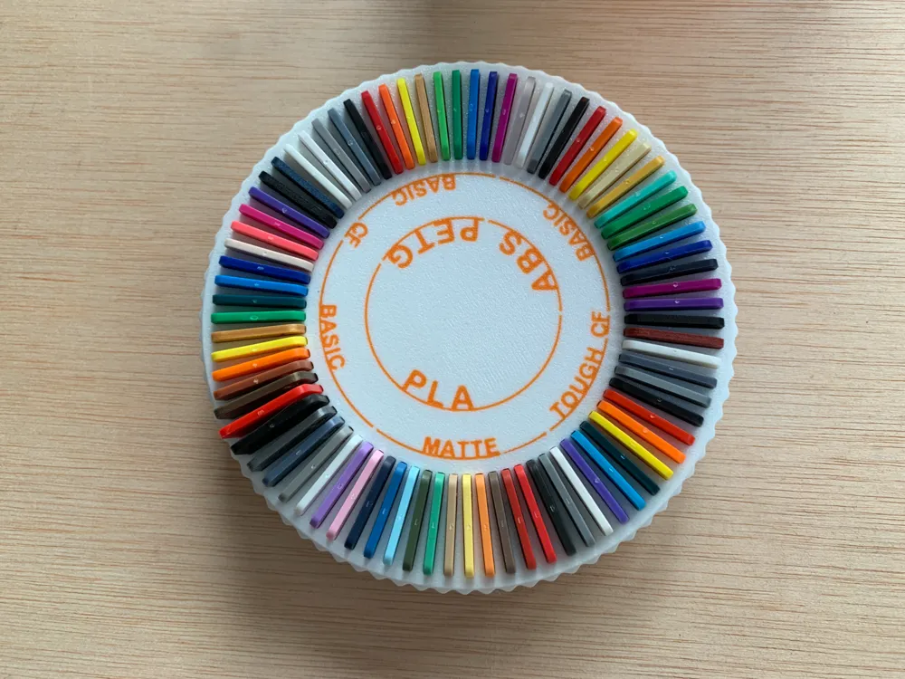 Spinning filament swatch display with names Remixed by McFly - MakerWorld