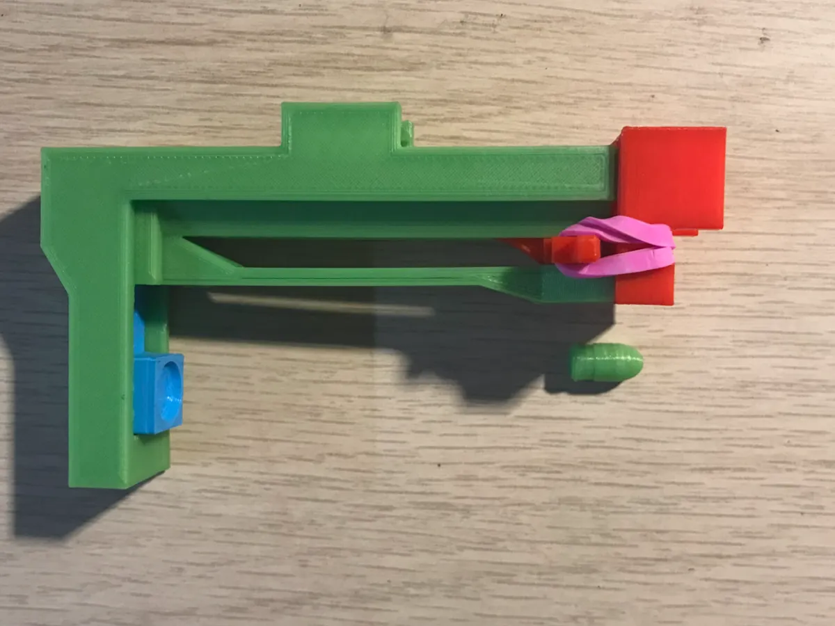 Fidget gun v1 (shoots) - Free 3D Print Model - MakerWorld