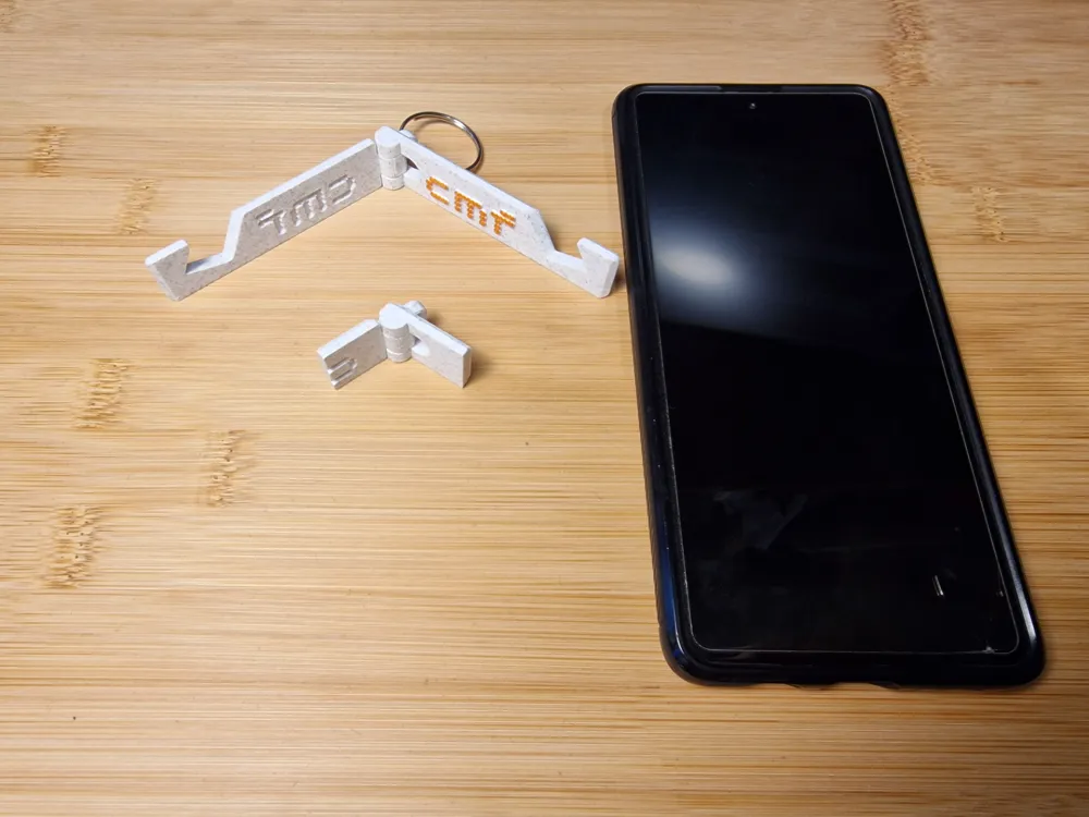 Foldable CMF Phone Stand - keychain/keyring by MJD - MakerWorld