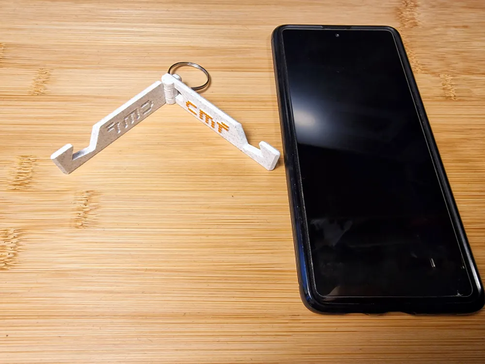Foldable CMF Phone Stand - keychain/keyring by MJD - MakerWorld
