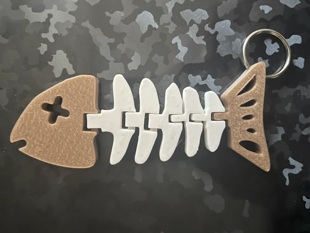 Articulated flexible fish bone keychain by Flywooki MakerWorld ...