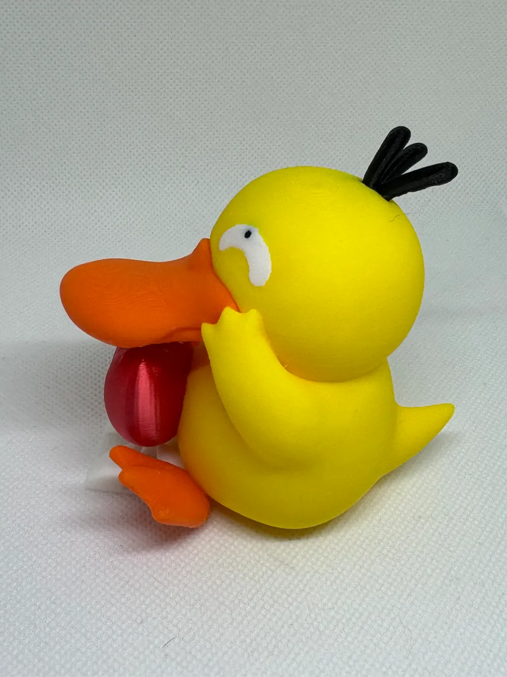 Psyduck with a heart - Pokemon figure with a large heart in front by ...
