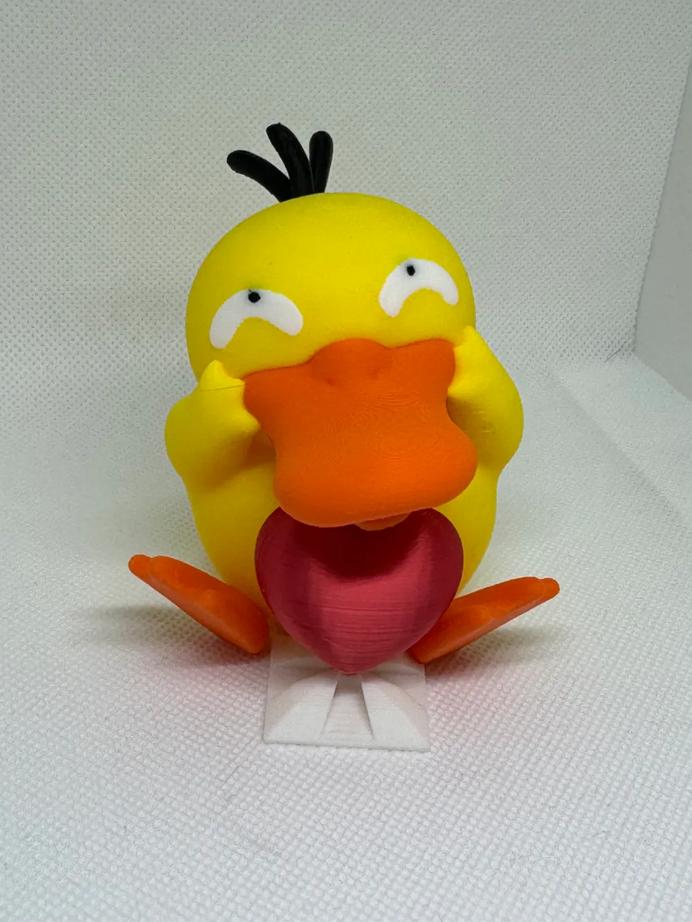Psyduck with a heart - Pokemon figure with a large heart in front by ...